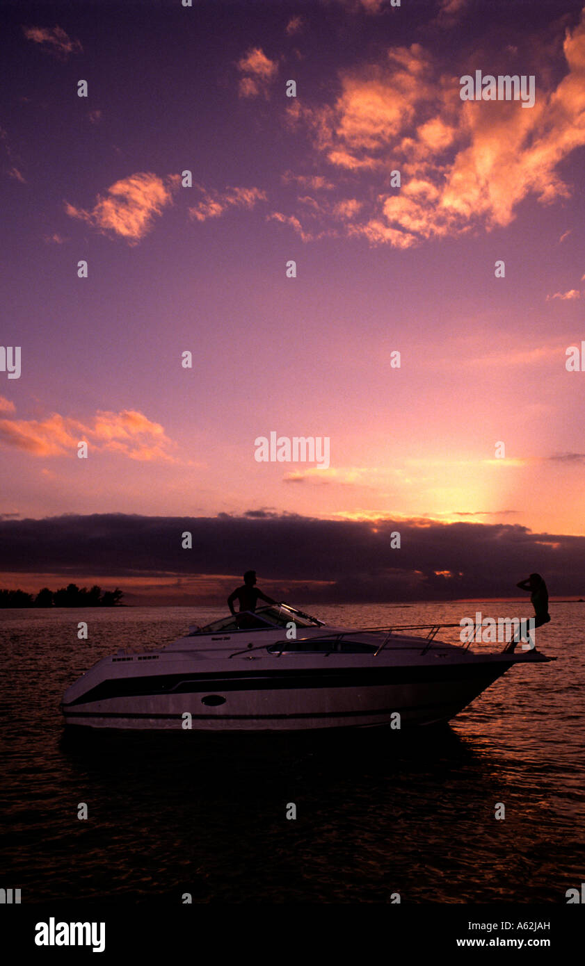 Sunset couple on elegant motor boat relaxing in the good life Stock ...