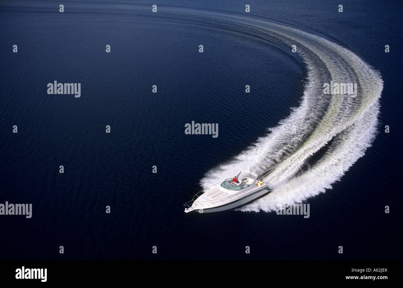 Graphic running motor boat with wake and excitement thru water with ...