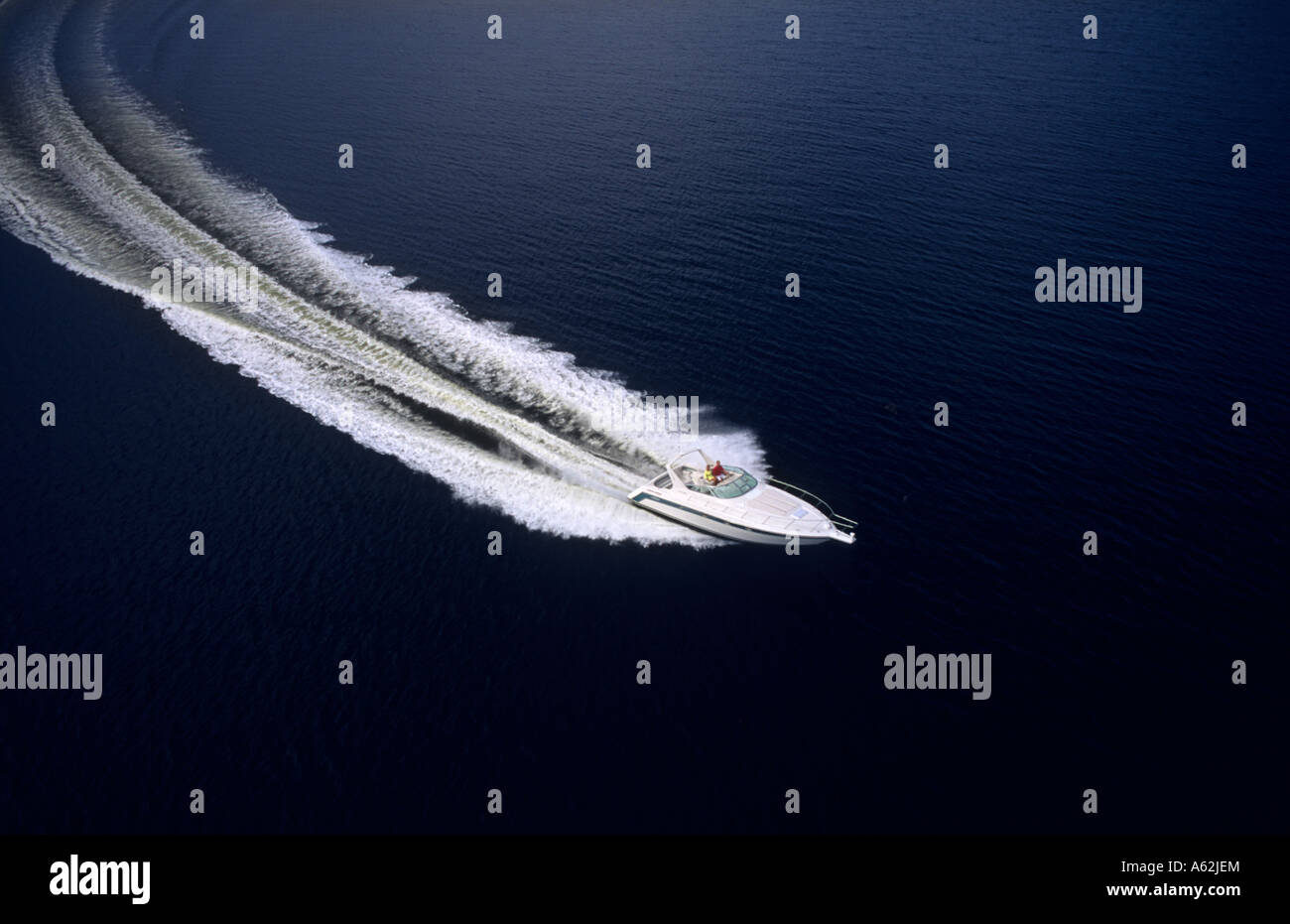 Graphic running motor boat with wake and excitement thru water with ...