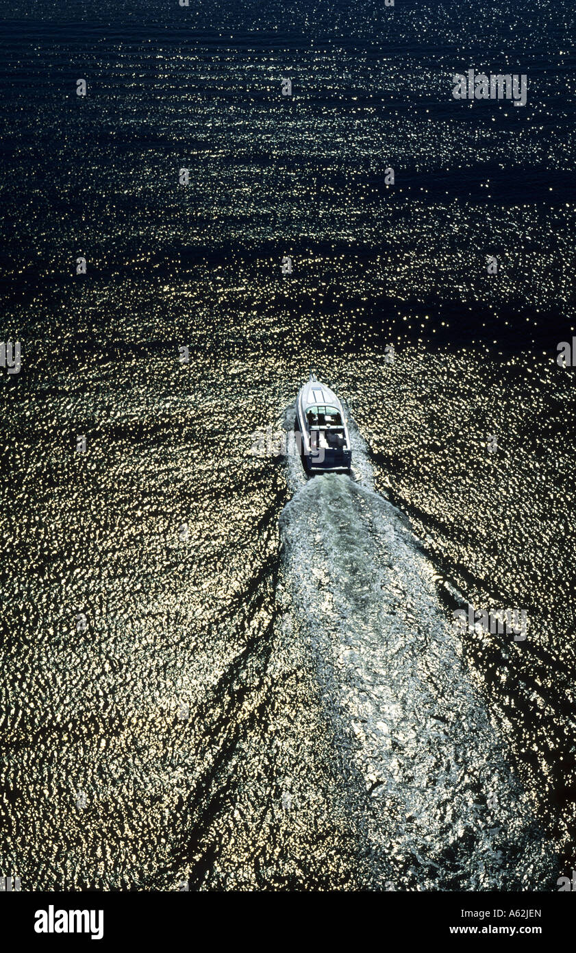 Graphic running motor boat with wake and excitement thru water with ...