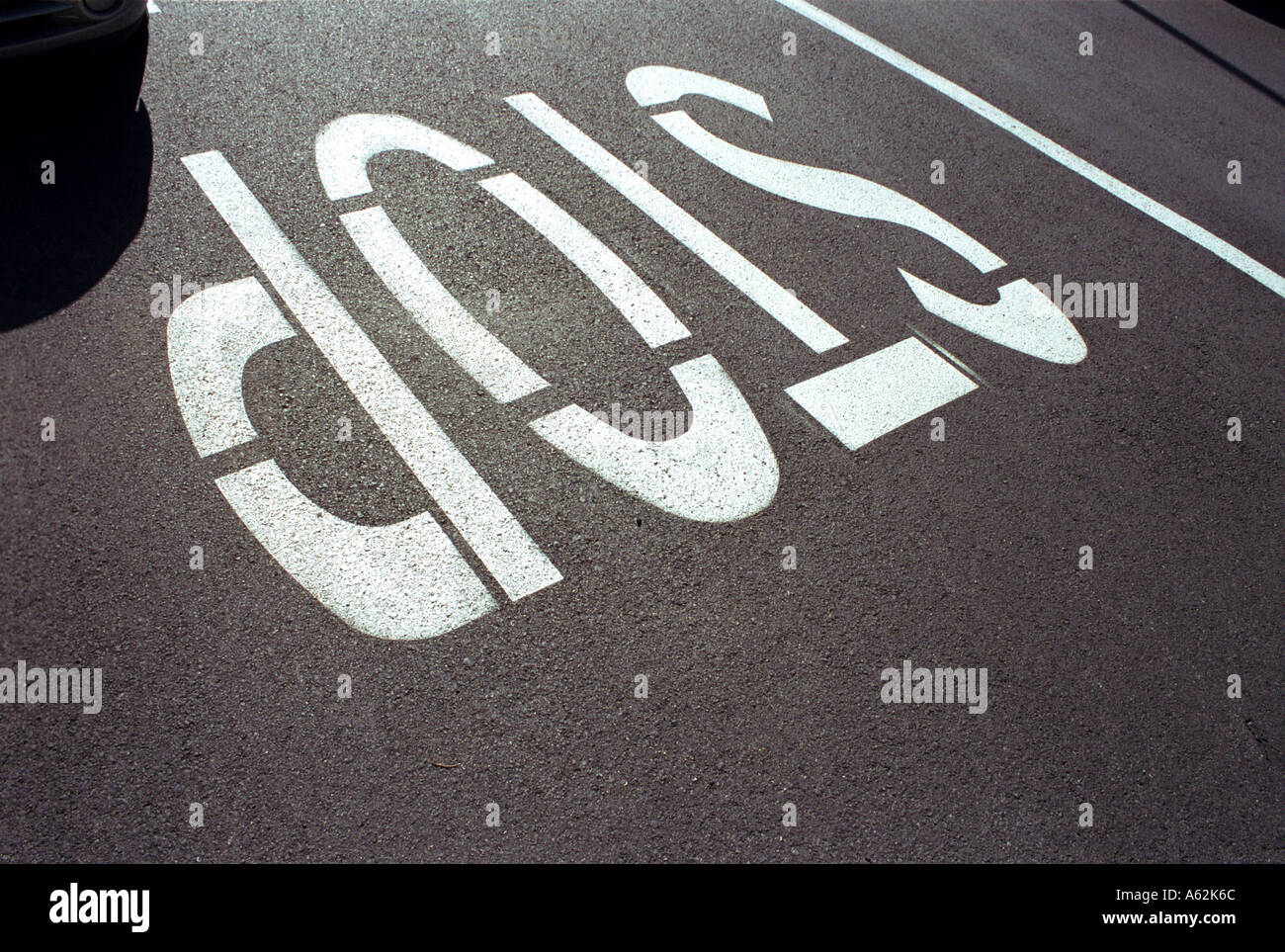 stop written on road Stock Photo - Alamy