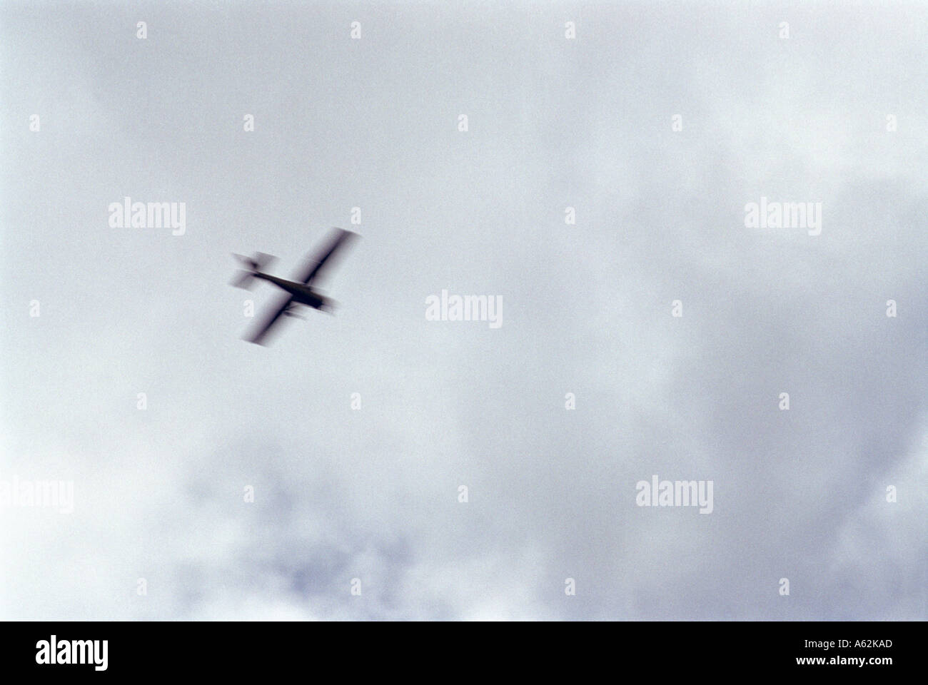 light plane moving across sky Stock Photo - Alamy