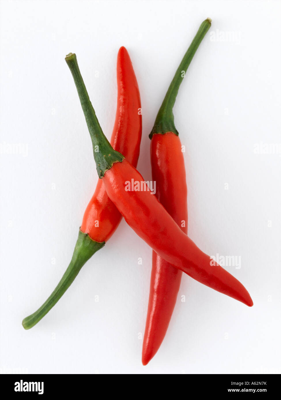 Three red chillies hi-res stock photography and images - Alamy