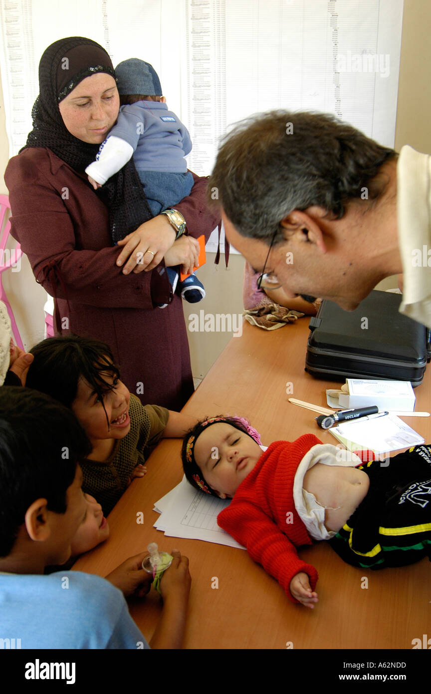 Palestinian children receive treatment at a medical clinic in the West ...