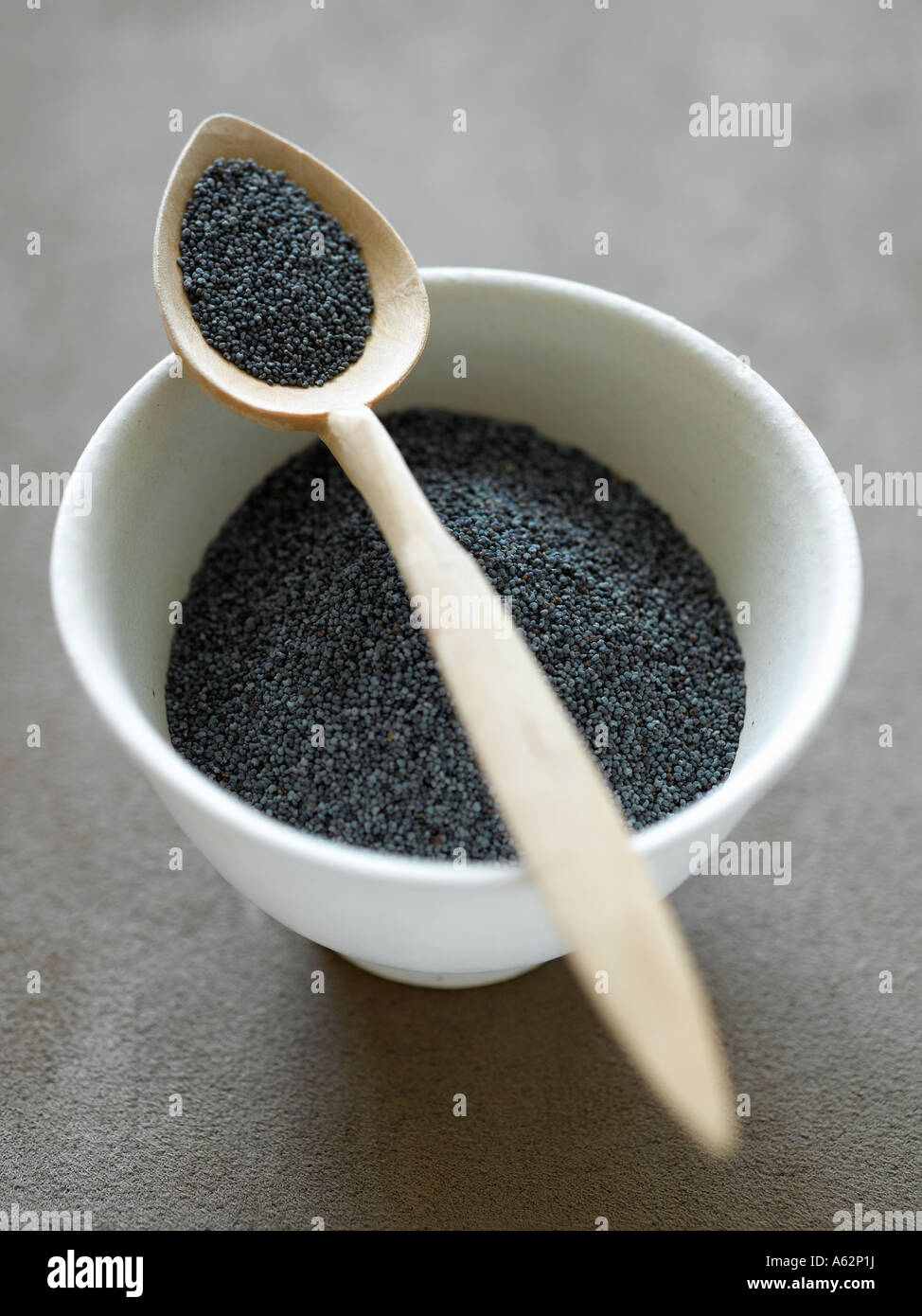 Blue poppy seeds Stock Photo - Alamy