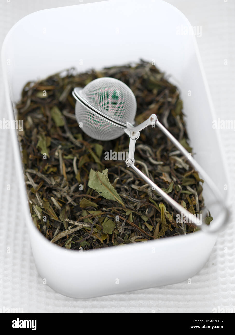 Still life white tea leaves Stock Photo - Alamy