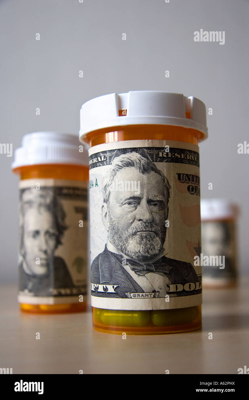 medication pill bottles with money attached to the front Stock Photo ...