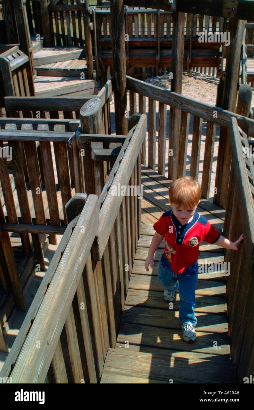 boy playing on wooden playground playscape park Stock Photo - Alamy