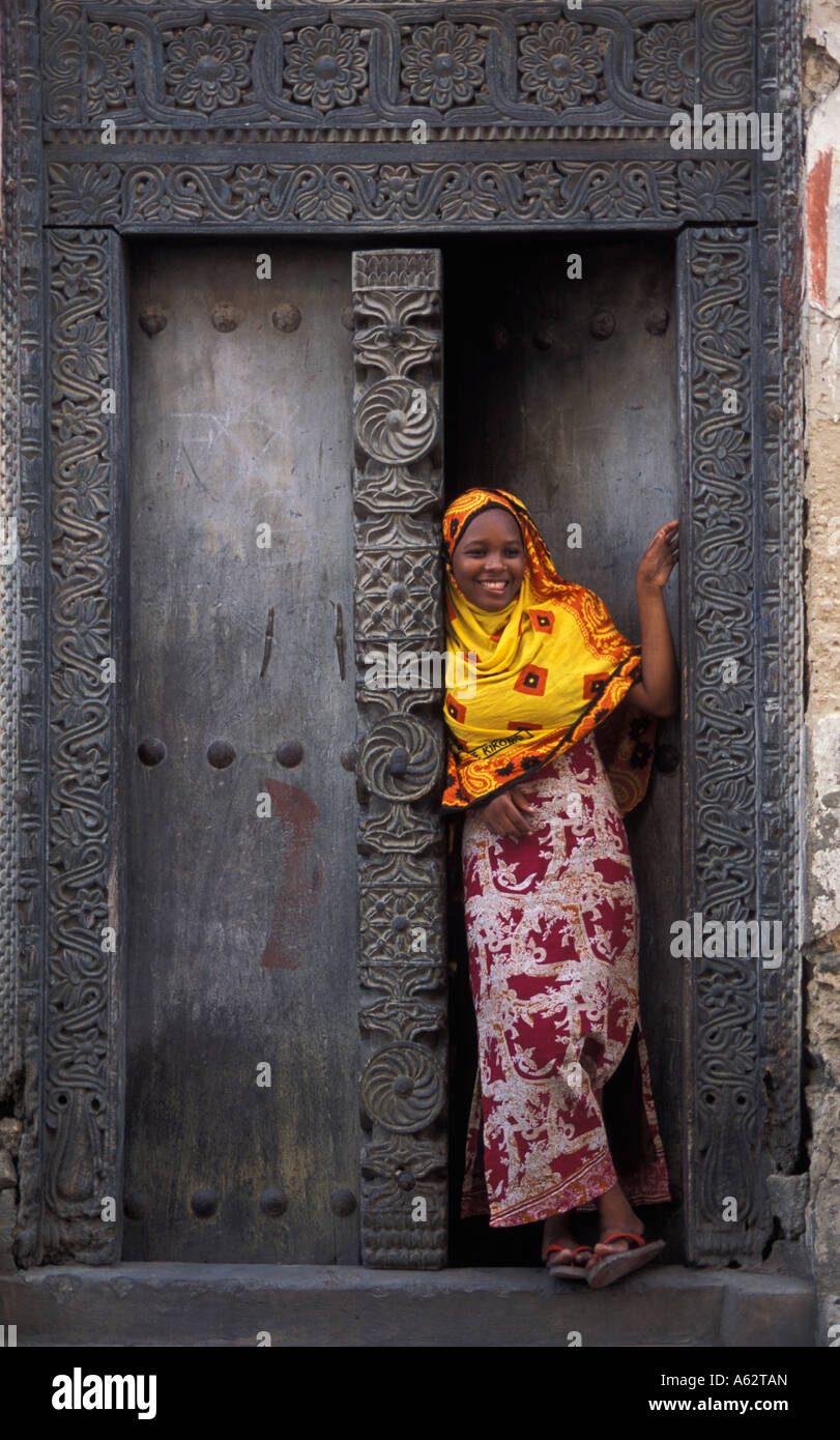 Swahili woman standing in a Zanzibar door Bagamoyo Tanzania Stock Photo ...