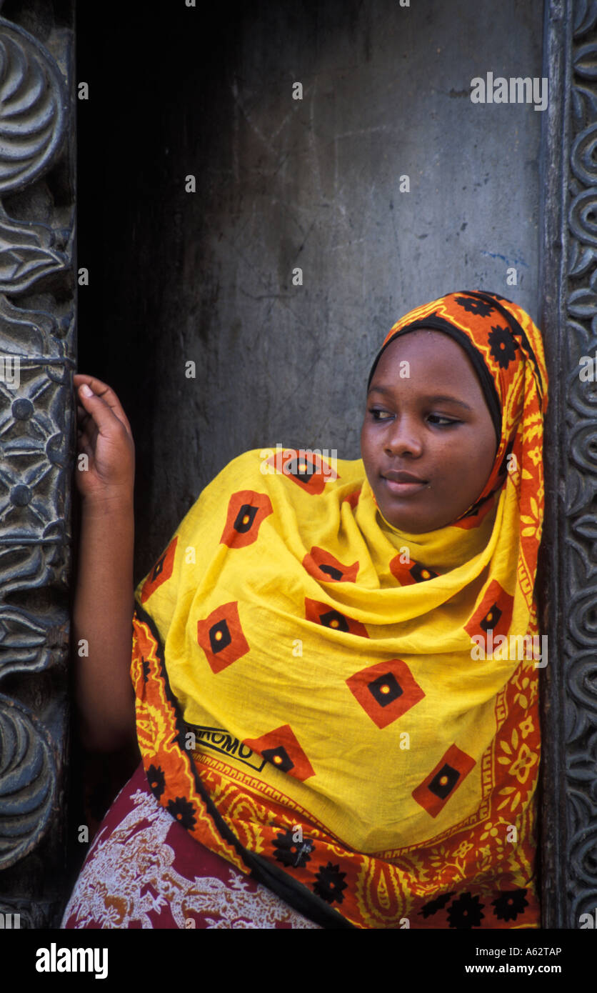Swahili woman standing in a Zanzibar door Bagamoyo Tanzania Stock Photo ...
