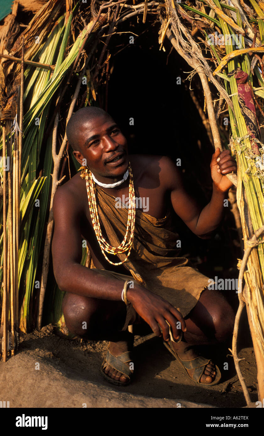 Hadza man in his hut Lake Eyasi Tanzania Small tribe of hunter ...