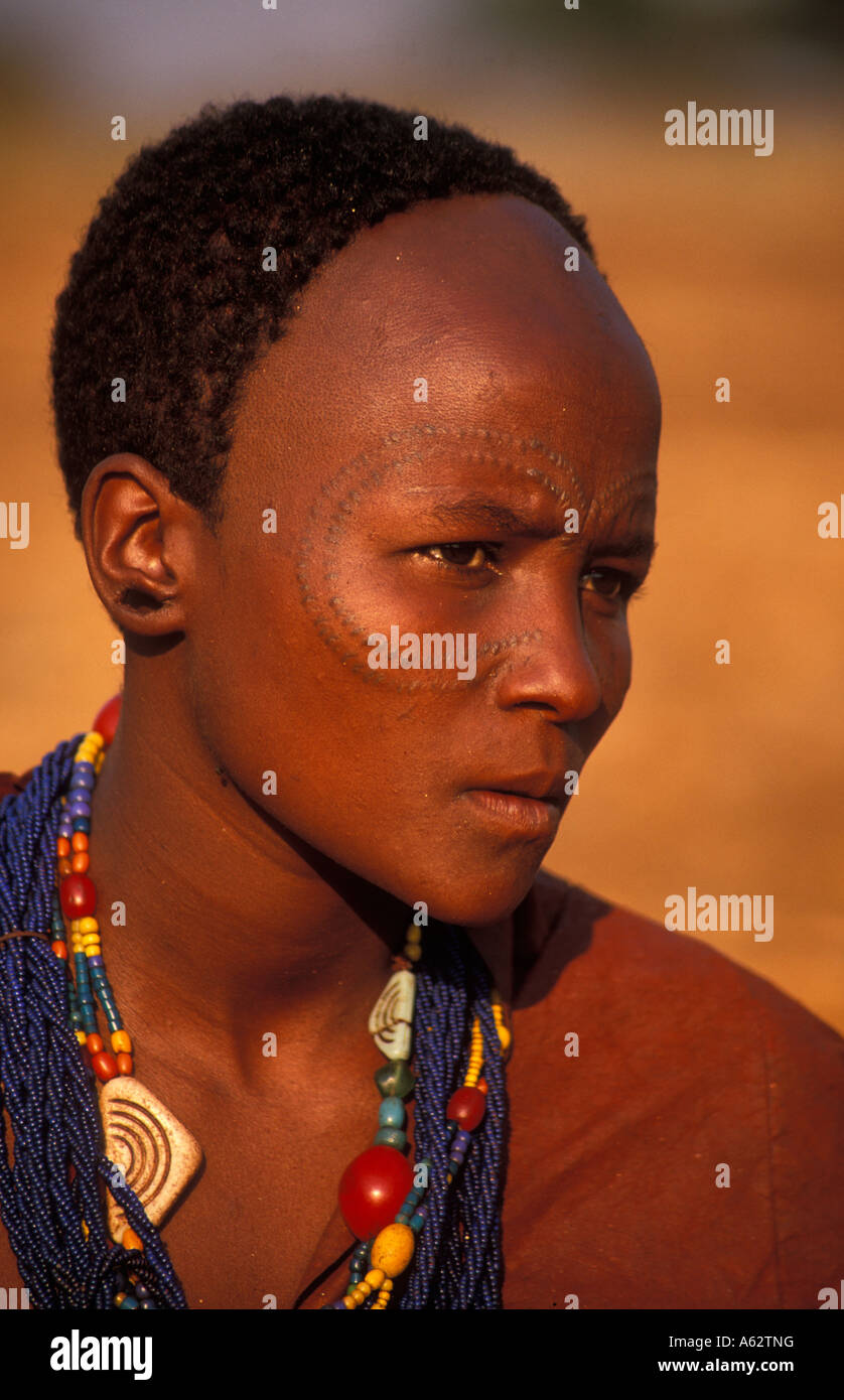 Barabaig bride wearing a traditional cow hide skin dress and with ...