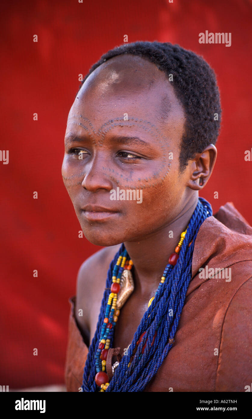 Barabaig bride wearing a traditional cow hide skin dress and with ...