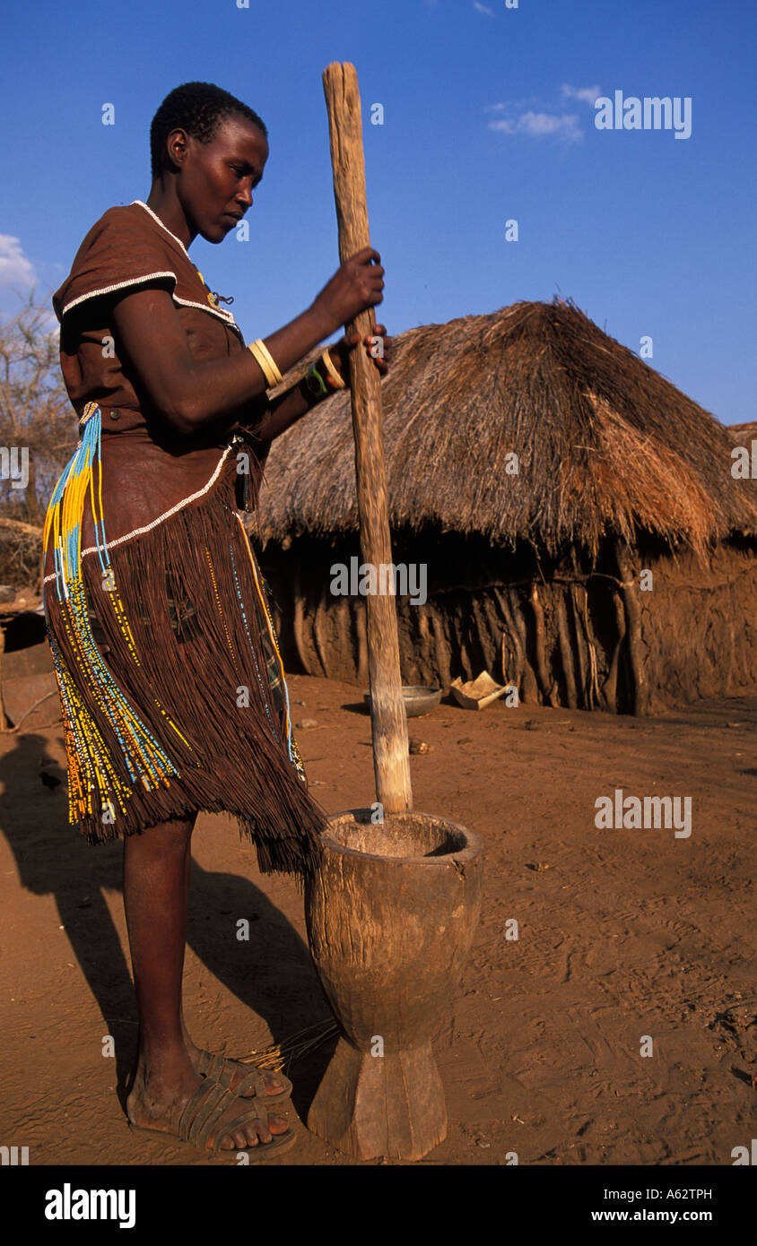 African woman pounding millet hi-res stock photography and images - Alamy