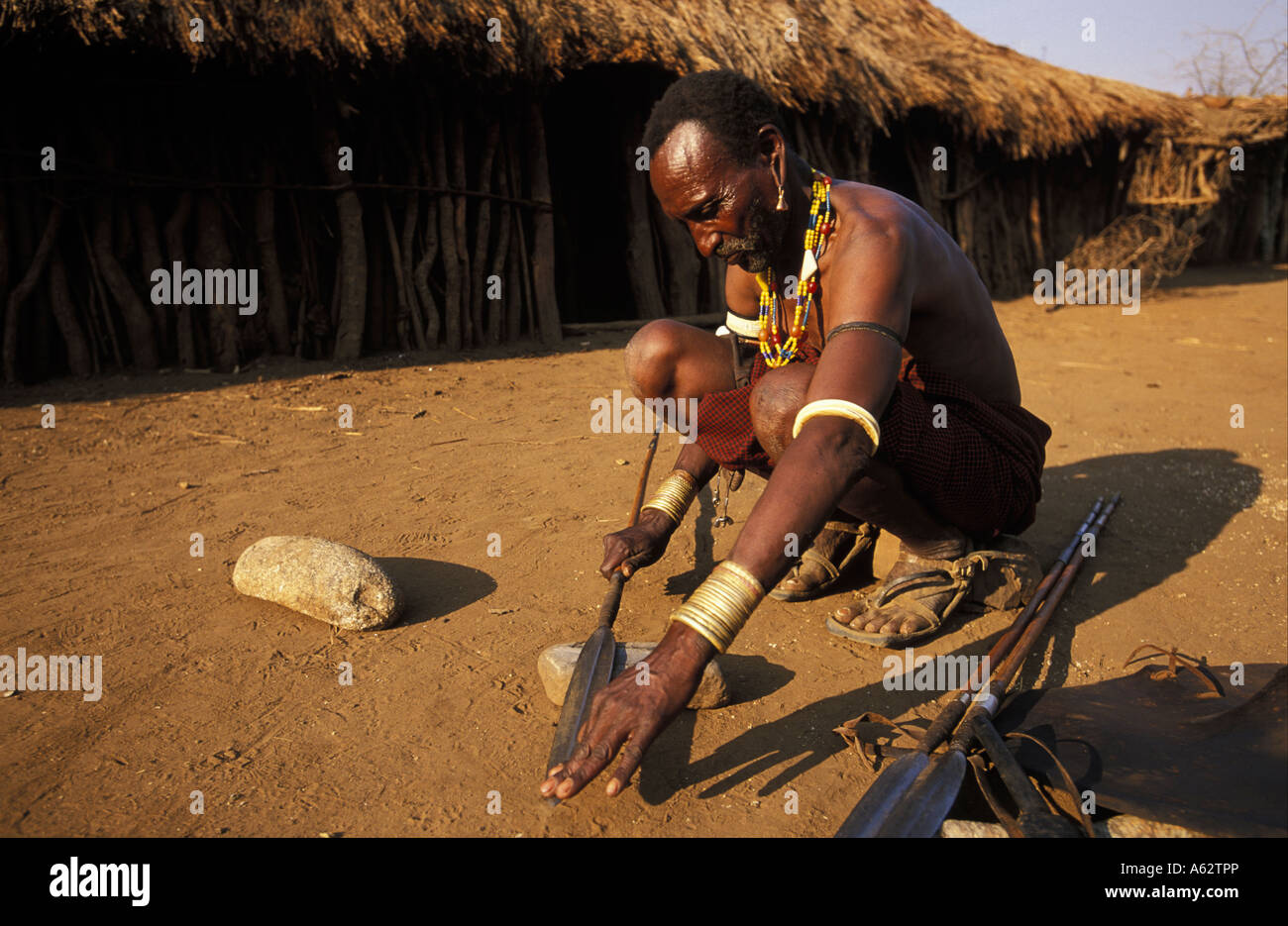 Barabaig man sharpening spears at his homestead in Dirma village Hanang ...