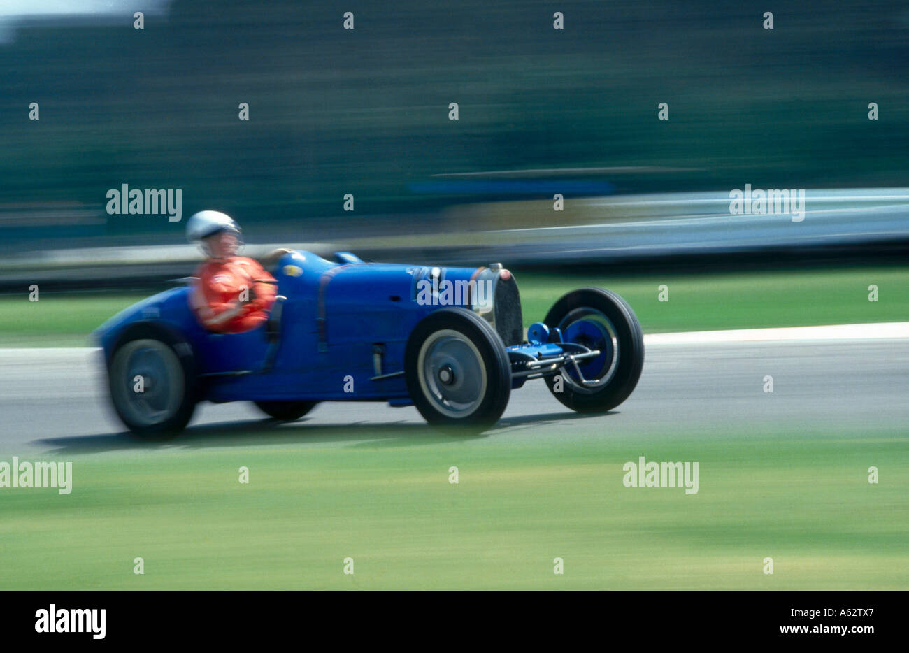 Man riding race car Stock Photo - Alamy