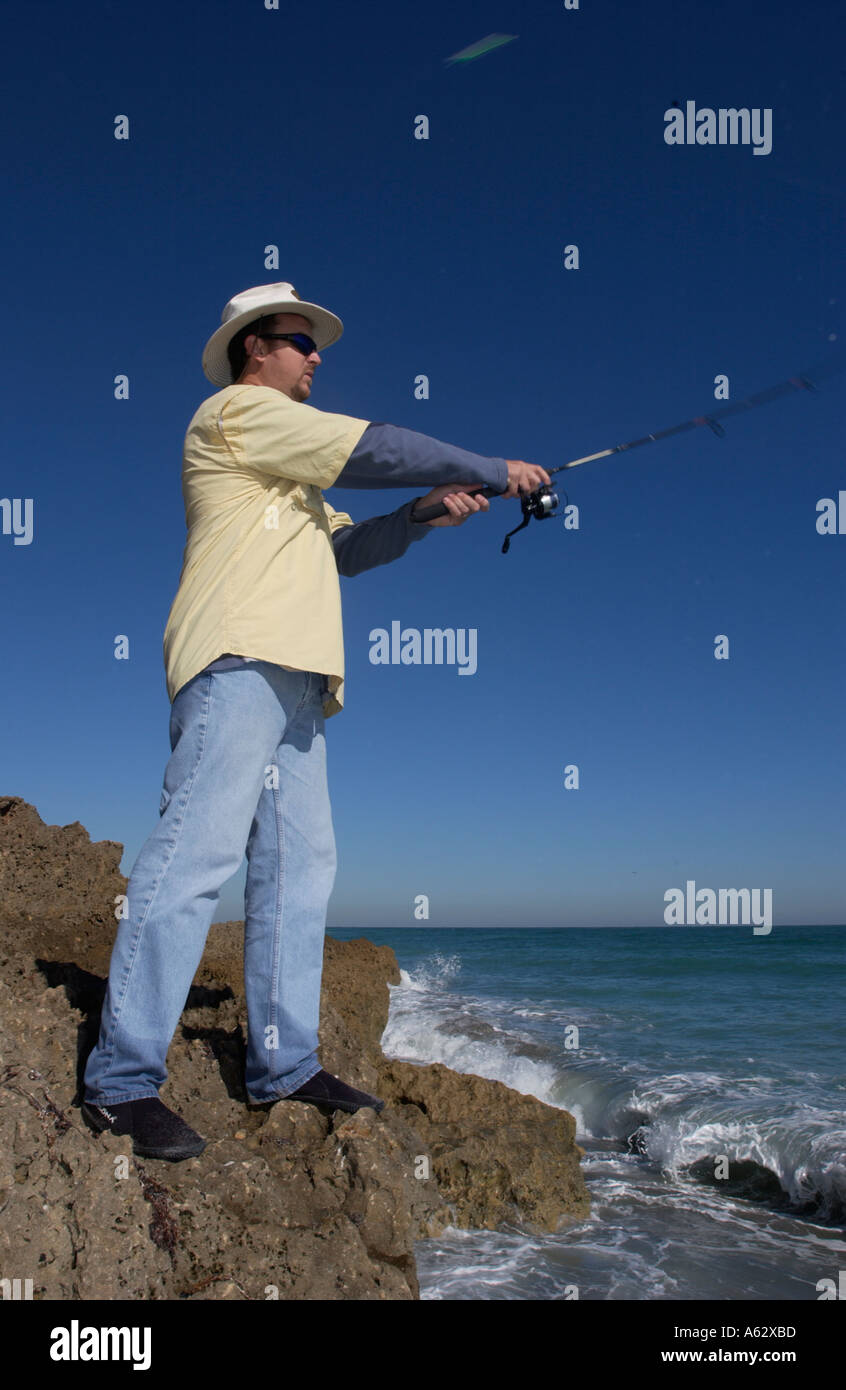 Man fishing on limestone shoreline of Hutchinson Island Stuart Martin ...