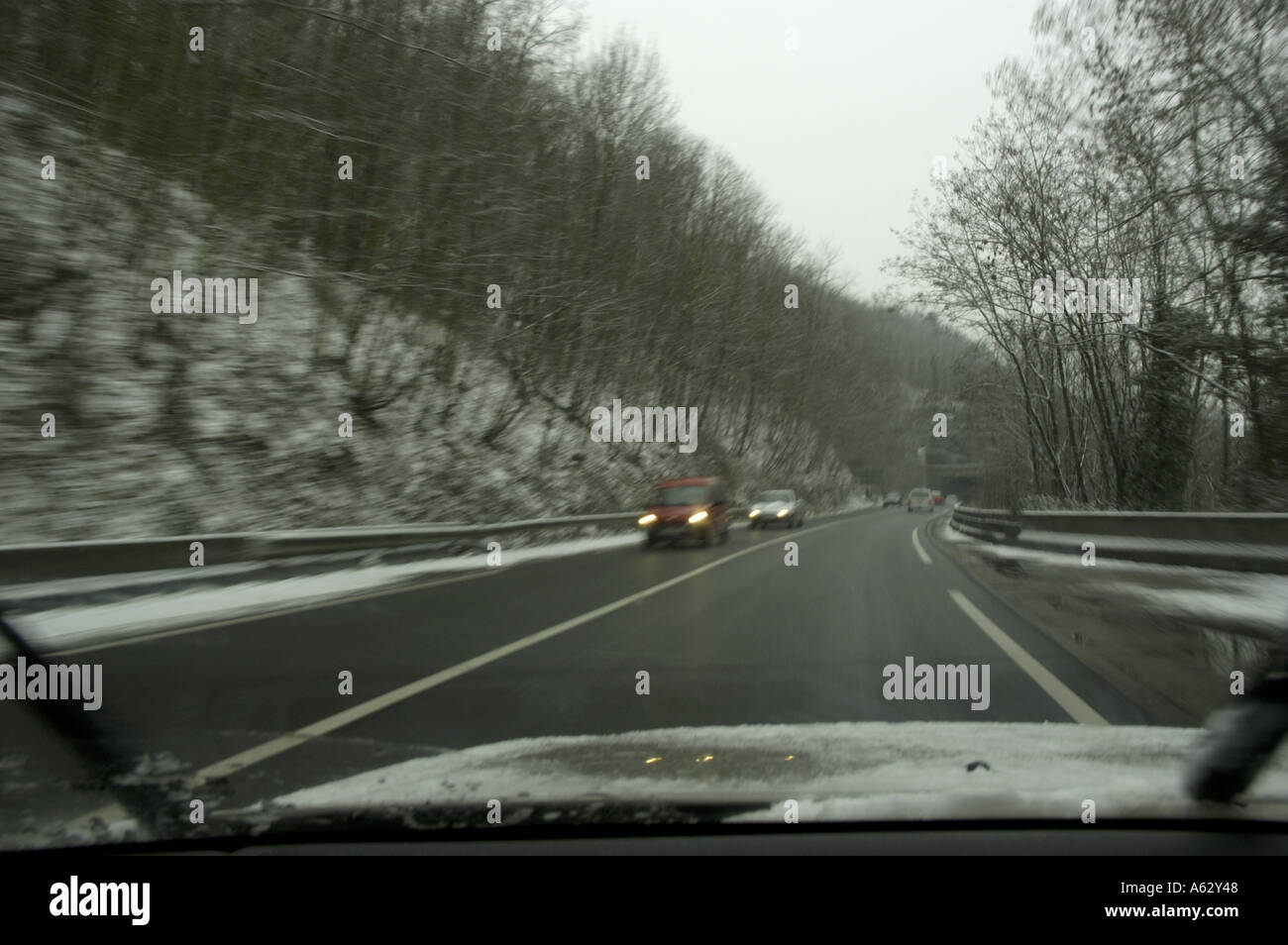 Inside a car driving on a snowy road in the winter Stock Photo - Alamy