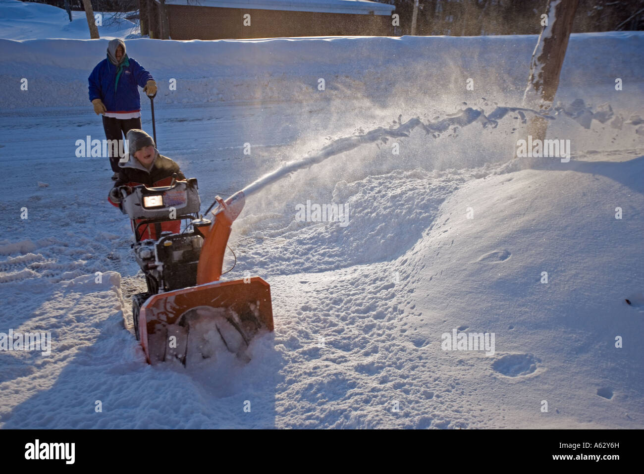 Young Boy Digging out from Snow Storm - Ithaca NY - Using snow blower ...