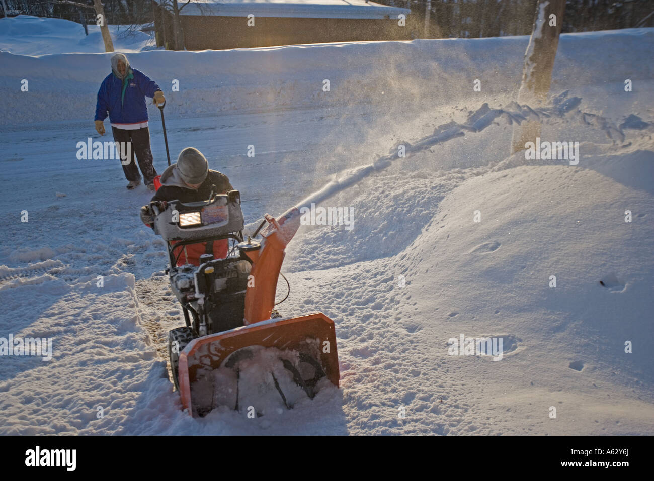 Young Boy Digging out from Snow Storm - Ithaca NY - Using snow blower ...