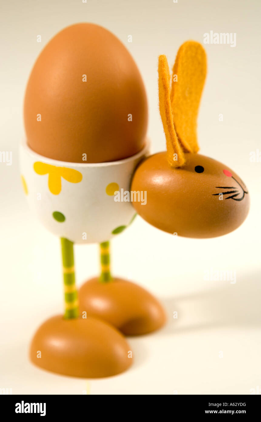 Novelty easter egg cup with a boiled egg Stock Photo - Alamy
