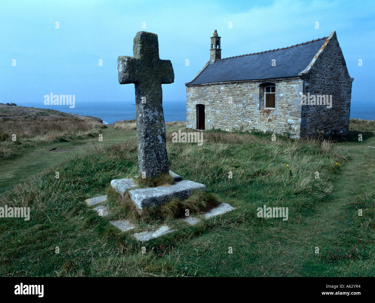 Cross in front of chapel, St. Samson Chapel, Finistere, Brittany ...