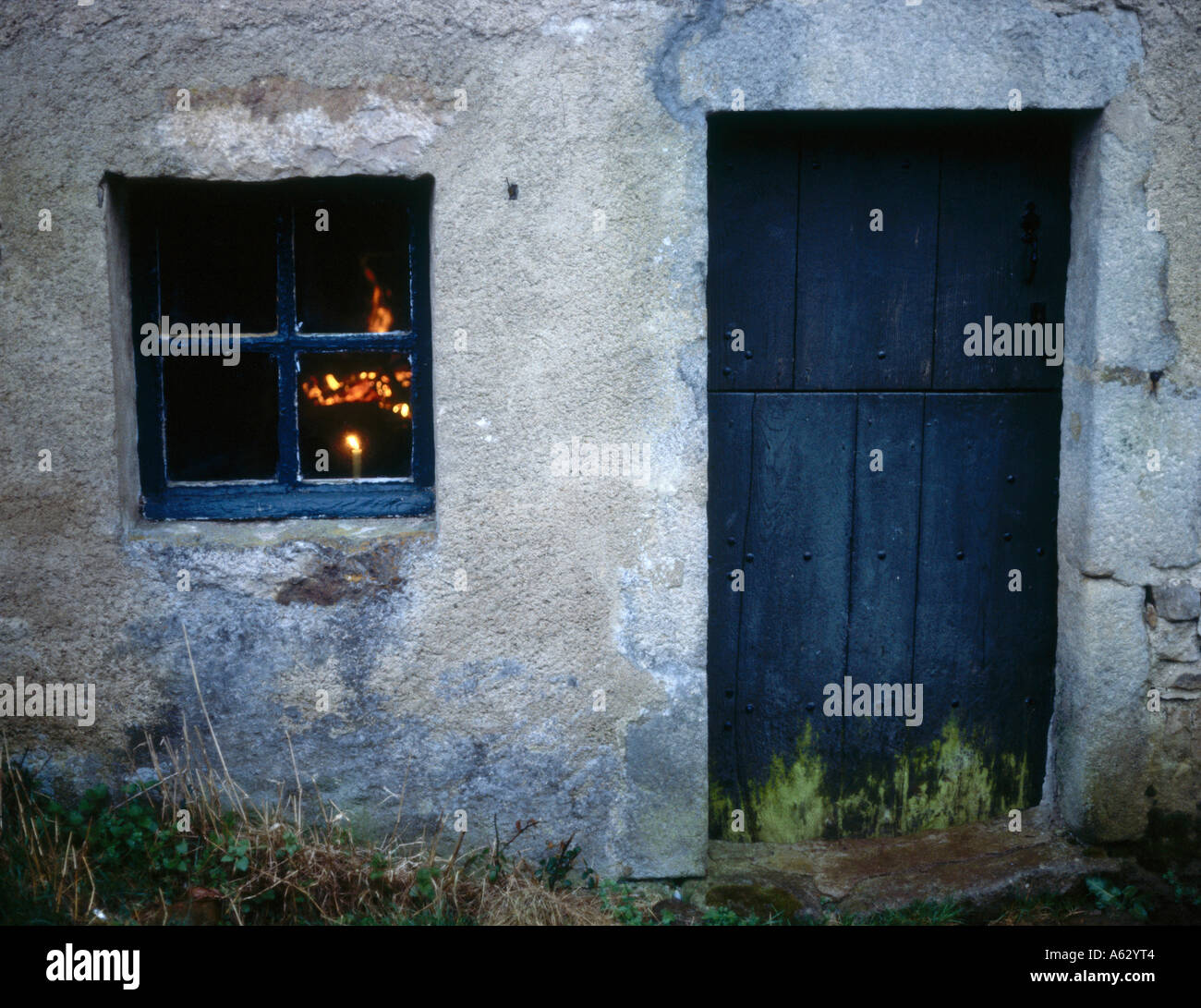Fireplace in house viewed through window Stock Photo - Alamy