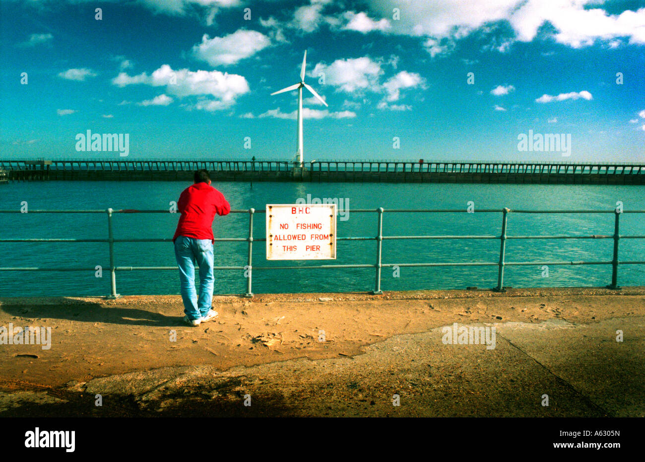 man in front of wind turbines at Blyth Harbour Stock Photo - Alamy