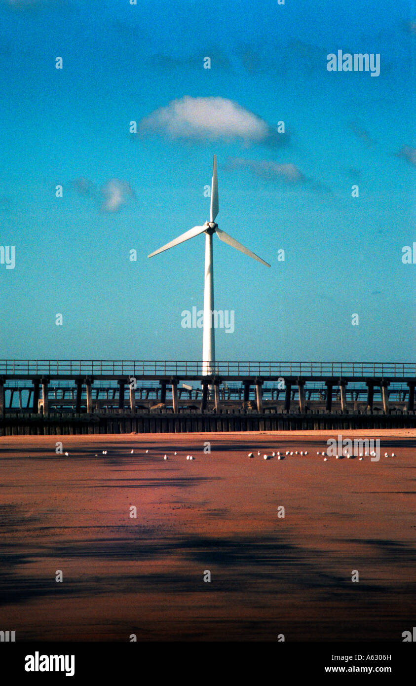 wind turbine on summers day behind a jetty Stock Photo - Alamy