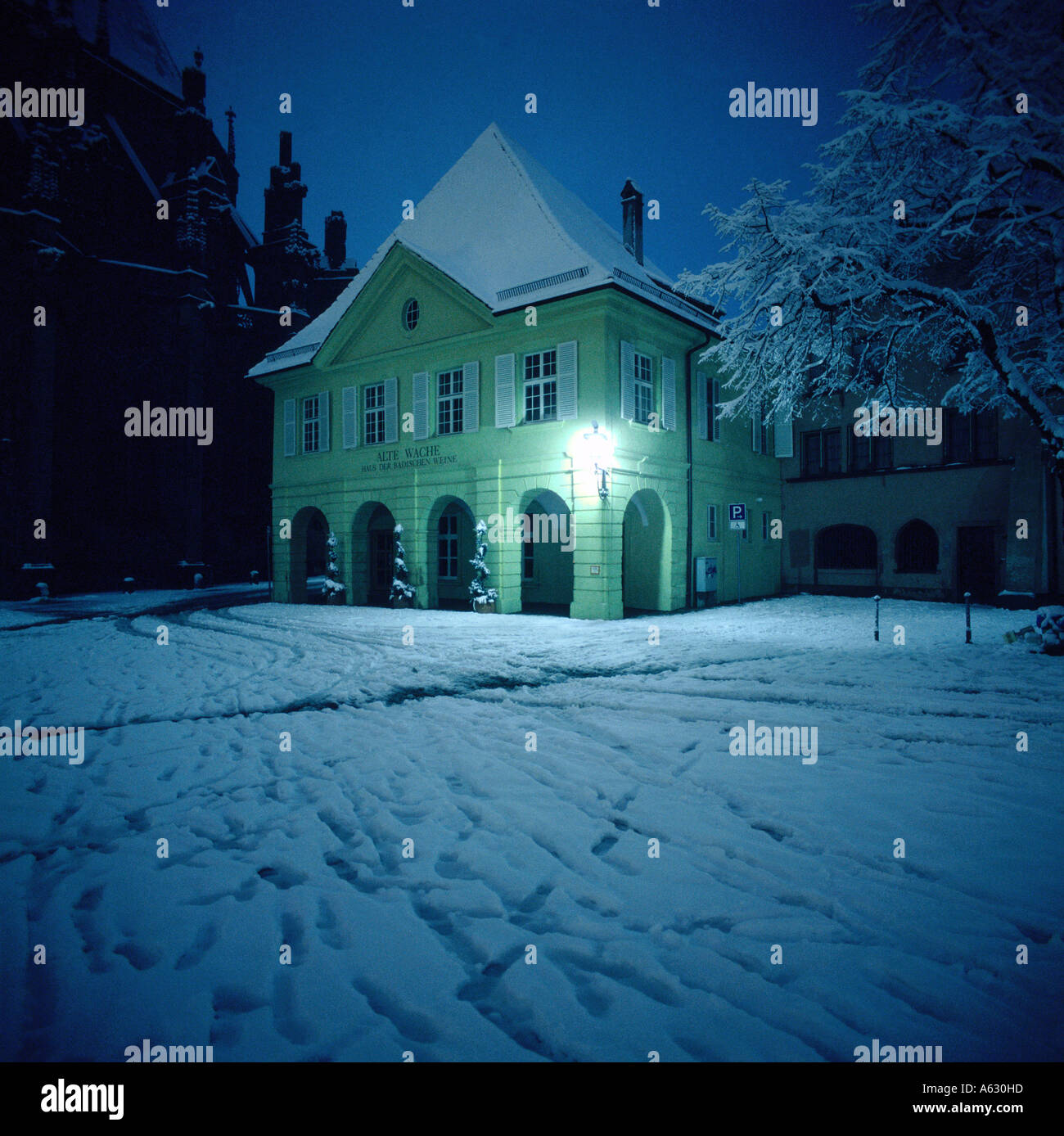 Building on snow-covered landscape lit up at night, Muensterplatz ...