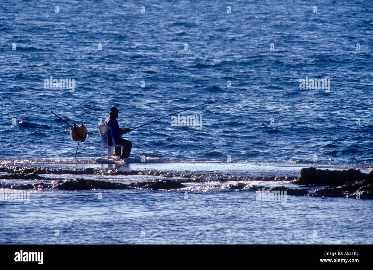 Fisherman fishing at coast, Lebanon Stock Photo - Alamy