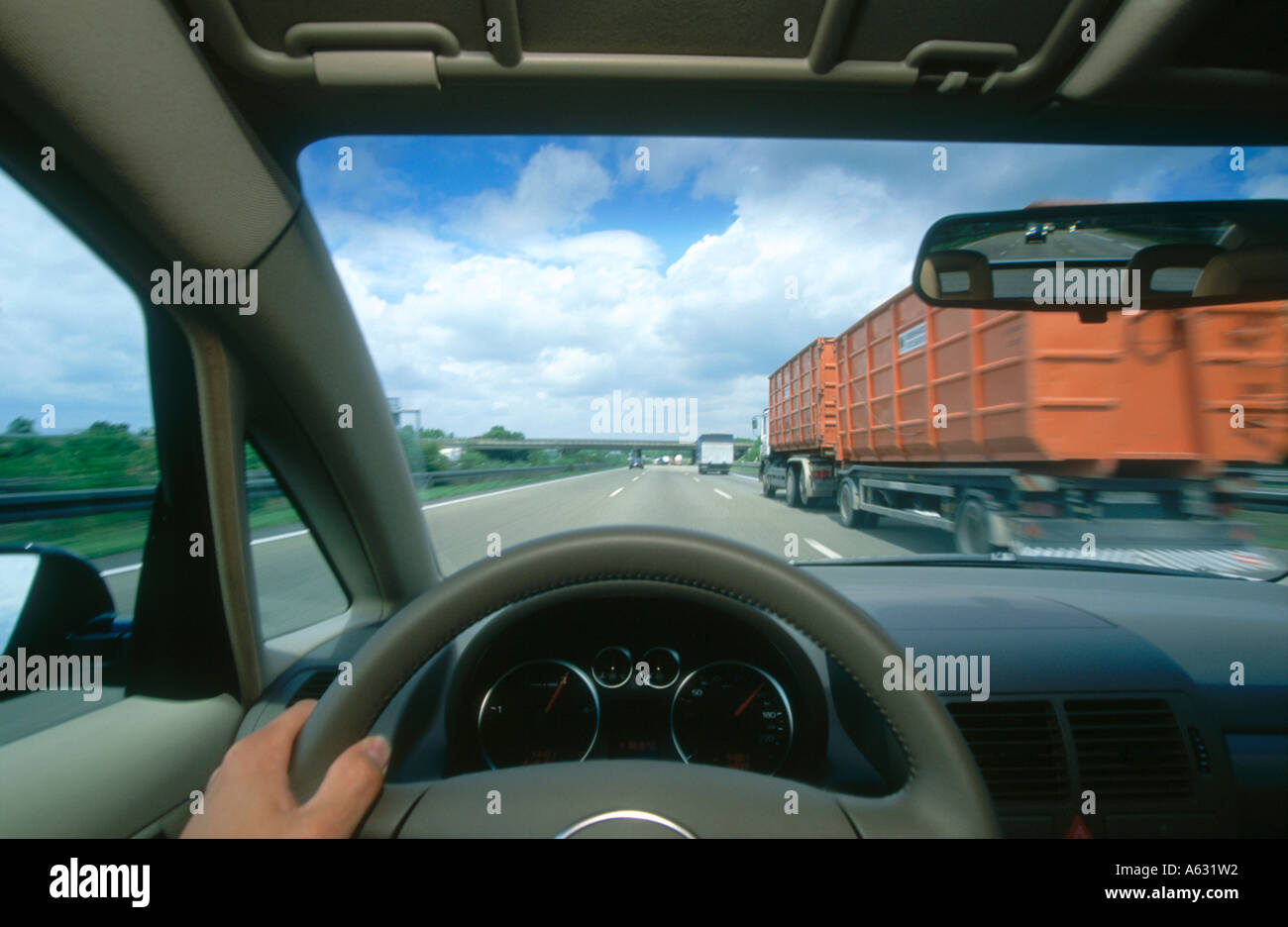 Driver driving car on highway Stock Photo - Alamy