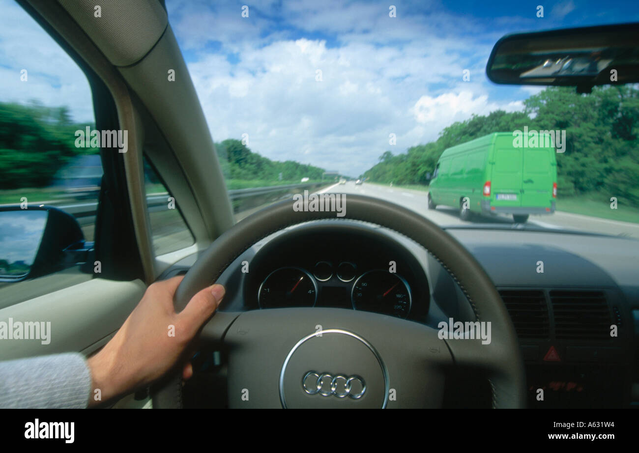 Driver driving car on highway Stock Photo - Alamy