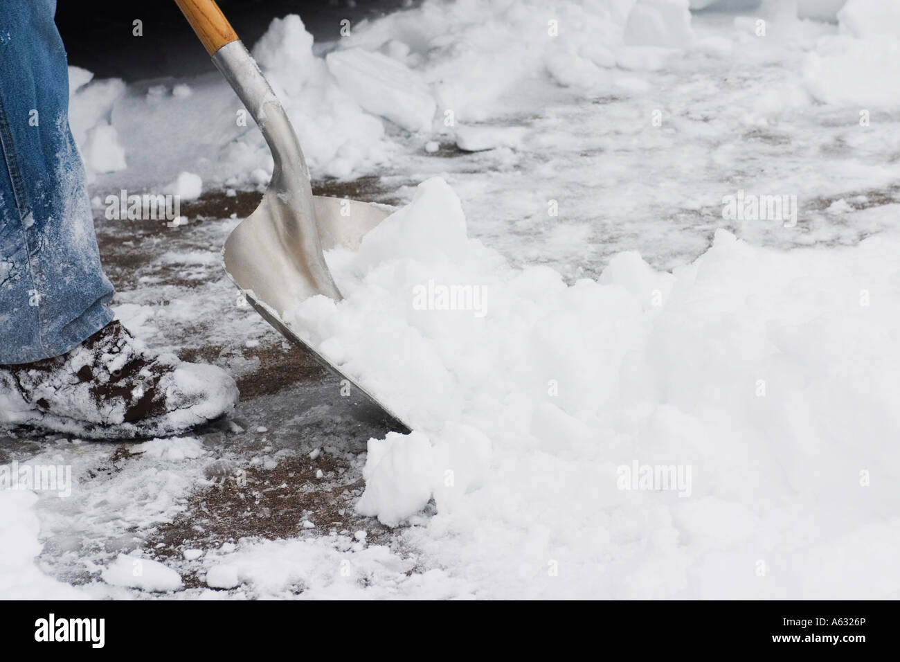 Person shoveling snow Stock Photo - Alamy