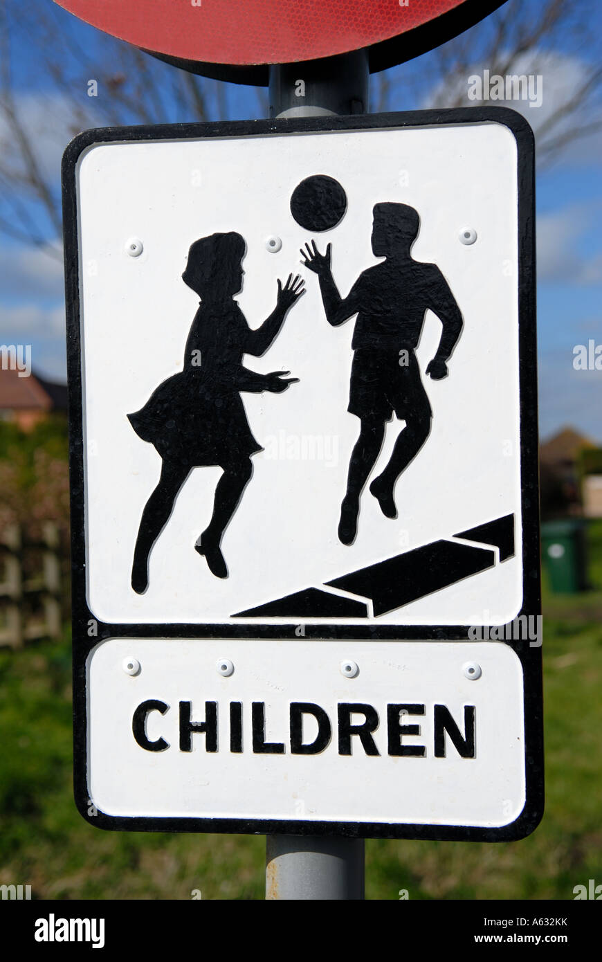 Road sign showing children playing with ball Stock Photo - Alamy