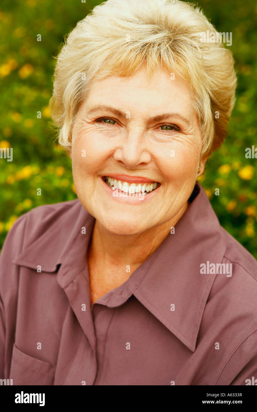 Portrait of a senior woman smiling Stock Photo - Alamy