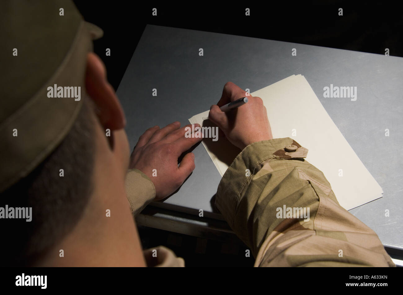 Military man writing letter Stock Photo - Alamy