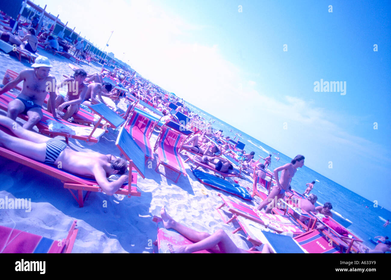 Tourists sunbathing on beach Stock Photo - Alamy