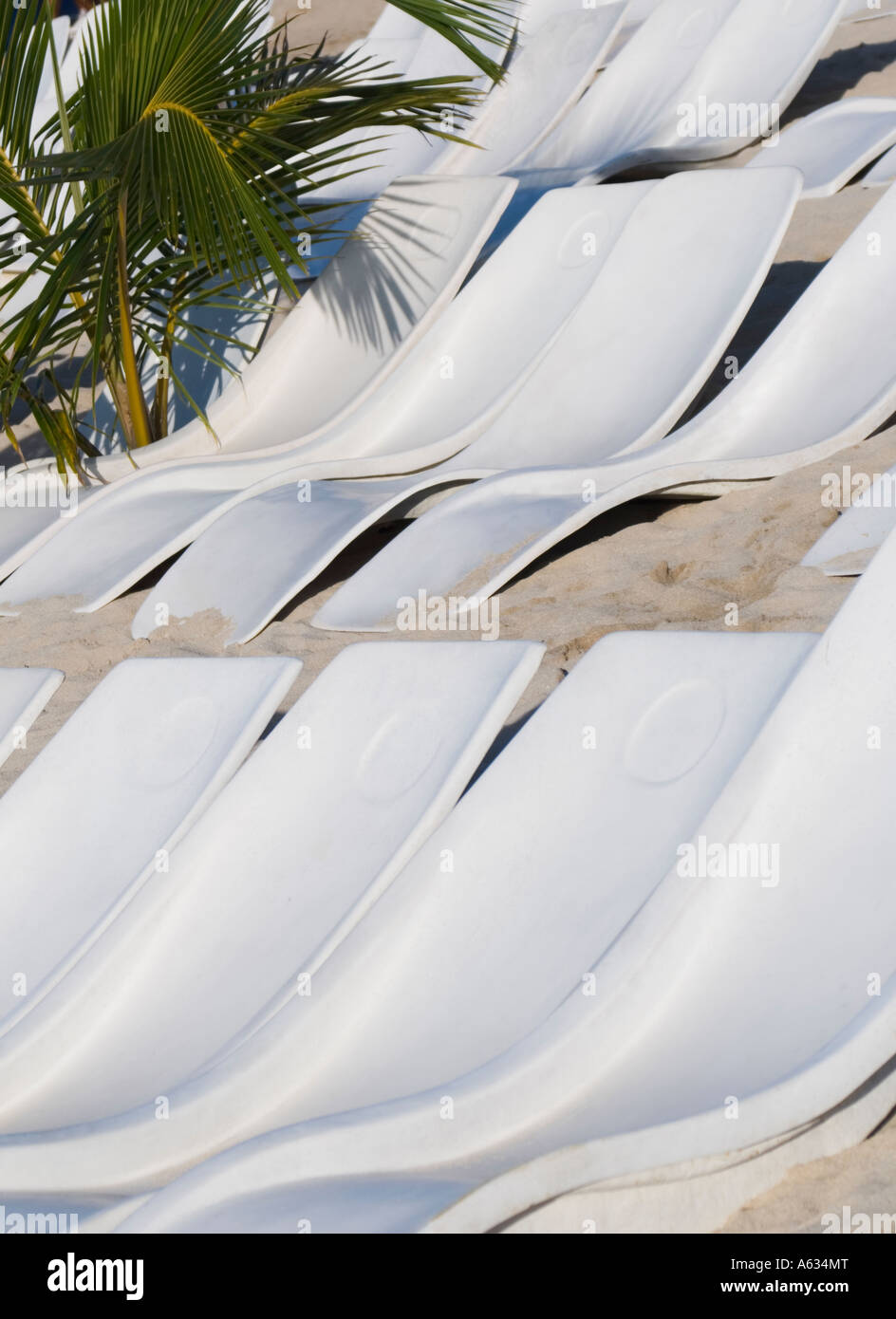 Lounge chairs on beach Stock Photo - Alamy