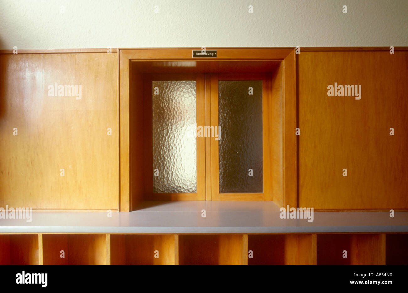 Reception window of office Stock Photo - Alamy