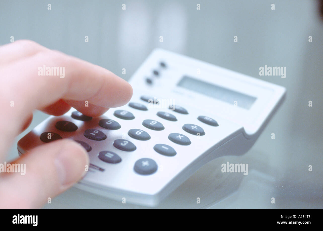Hands using calculator hi-res stock photography and images - Alamy