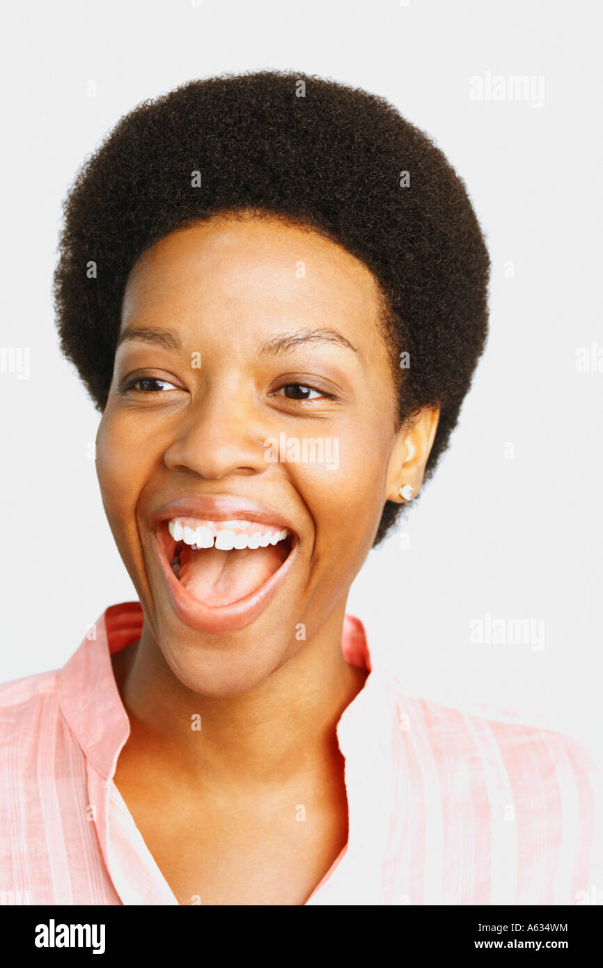 Close-up of a young woman laughing Stock Photo - Alamy