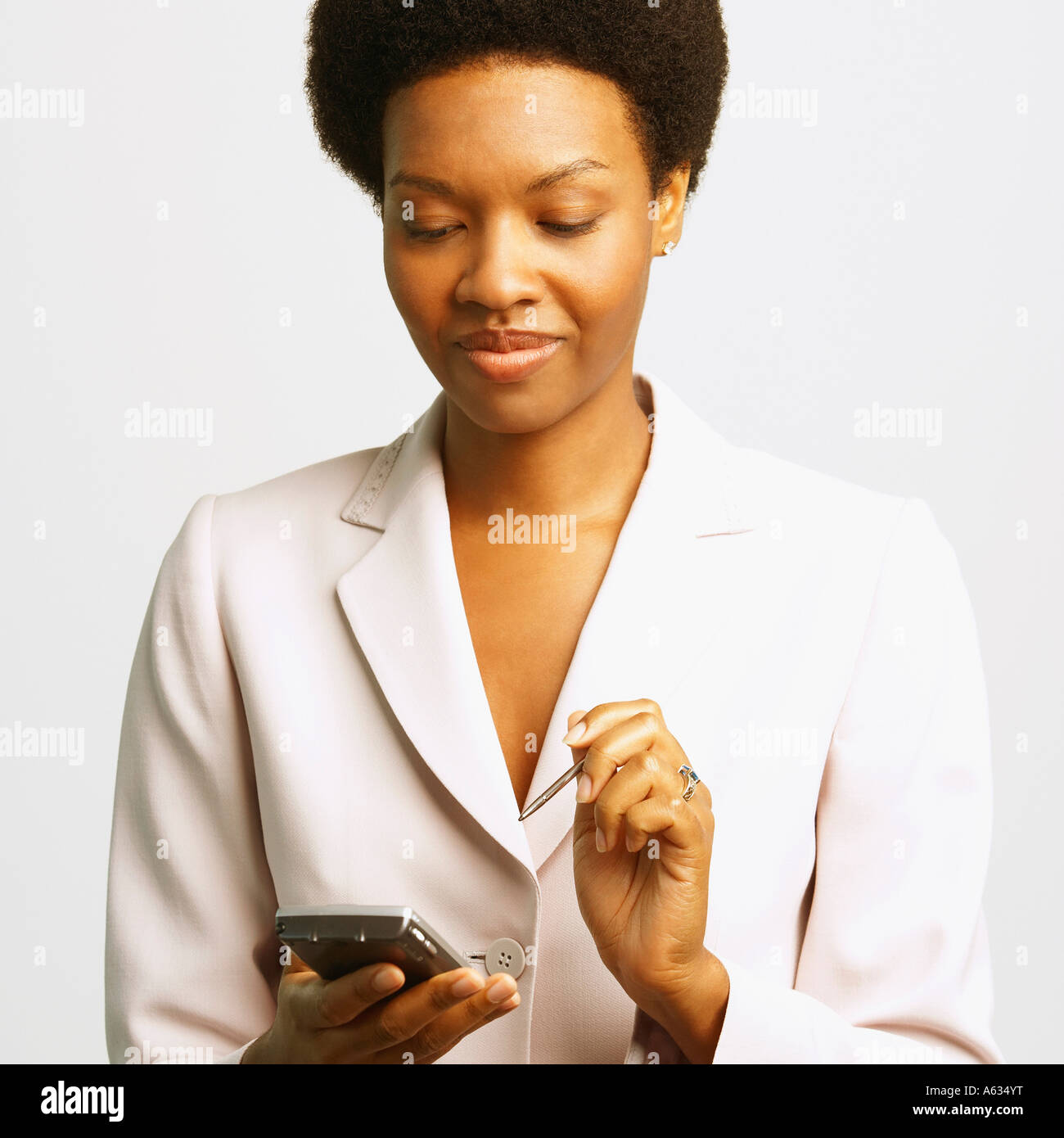 Close-up of a businesswoman using a personal data assistant Stock Photo ...
