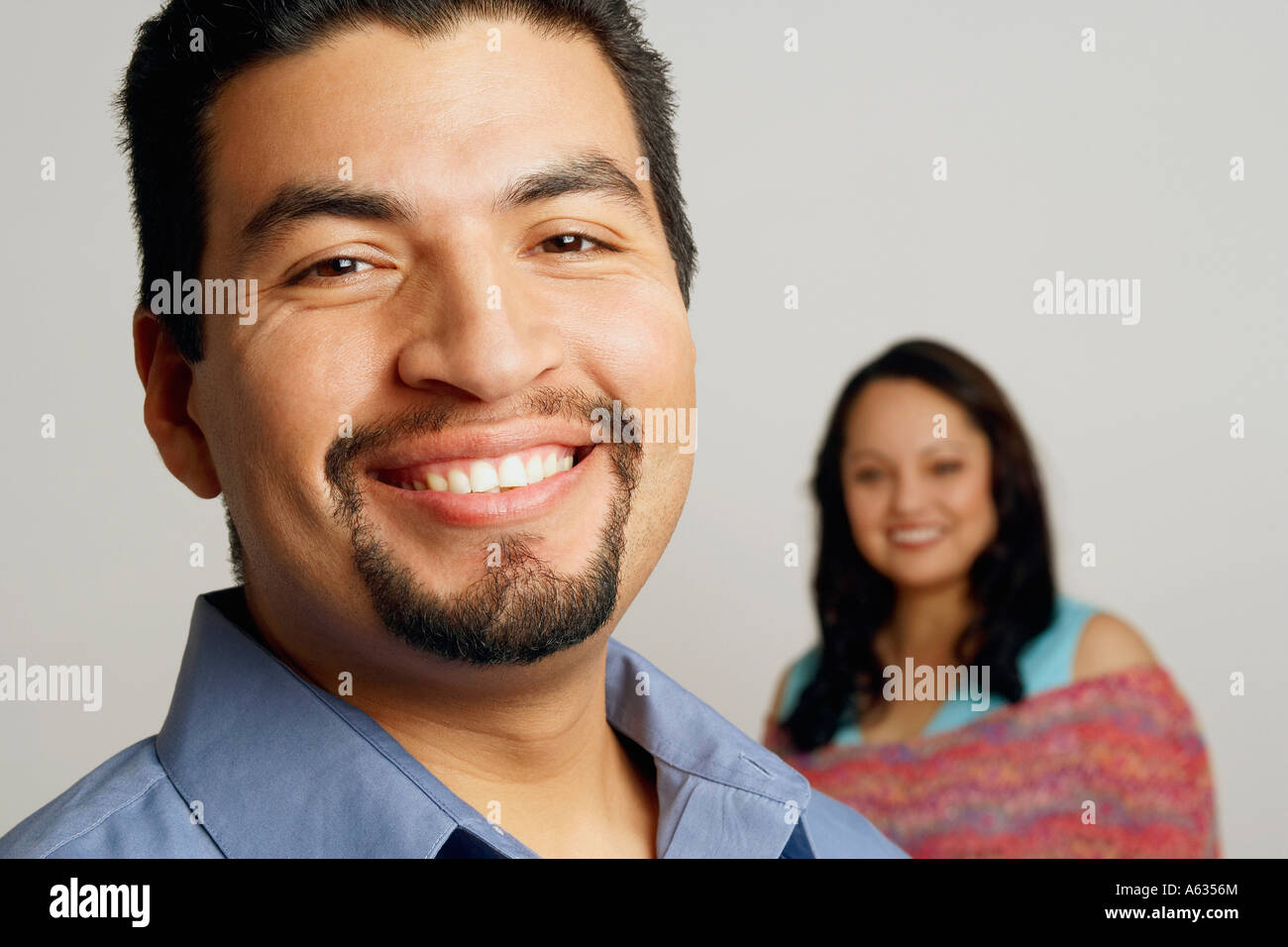 Portrait of a mid adult man smiling with a mid adult woman in the ...