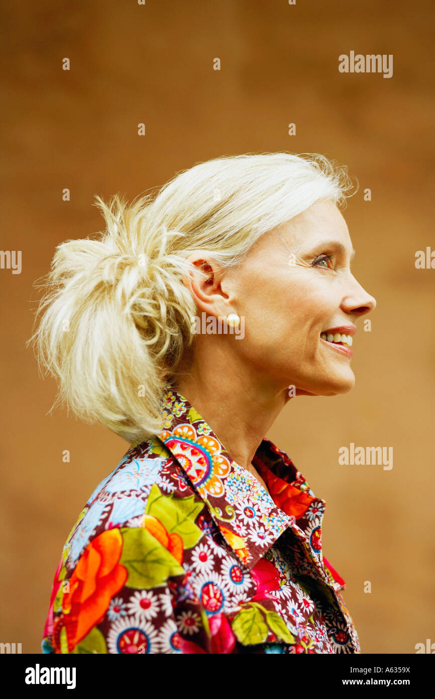 Side profile of a senior woman smiling Stock Photo - Alamy
