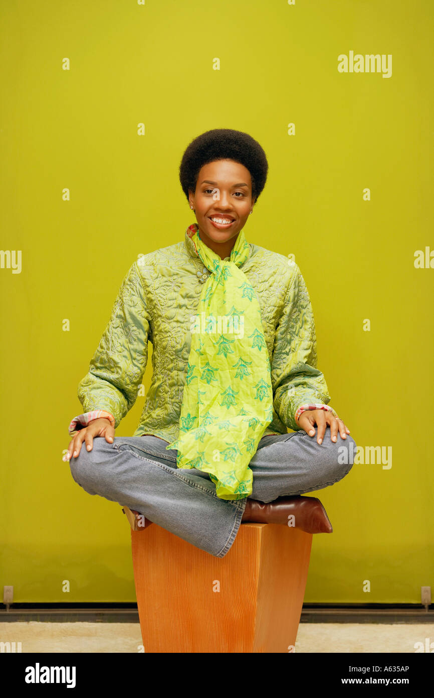 African american woman sitting on stool hi-res stock photography and ...