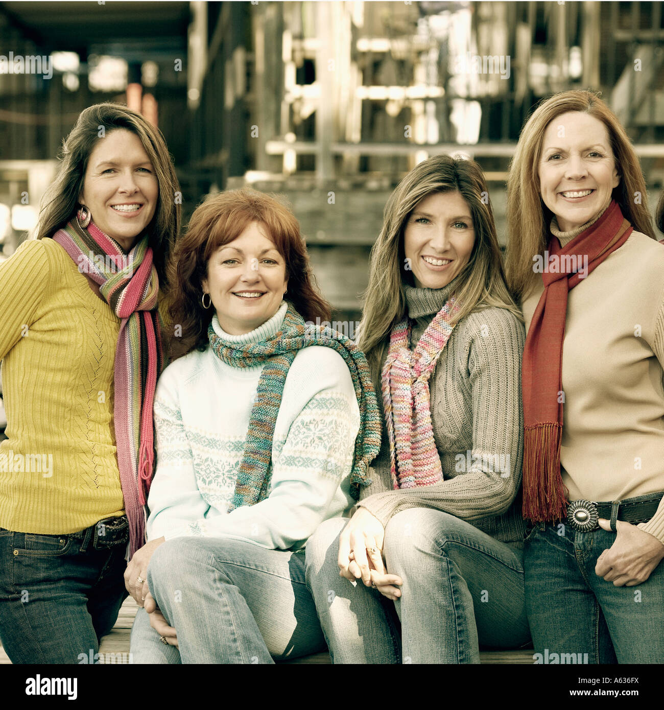 Portrait of four young women smiling Stock Photo - Alamy
