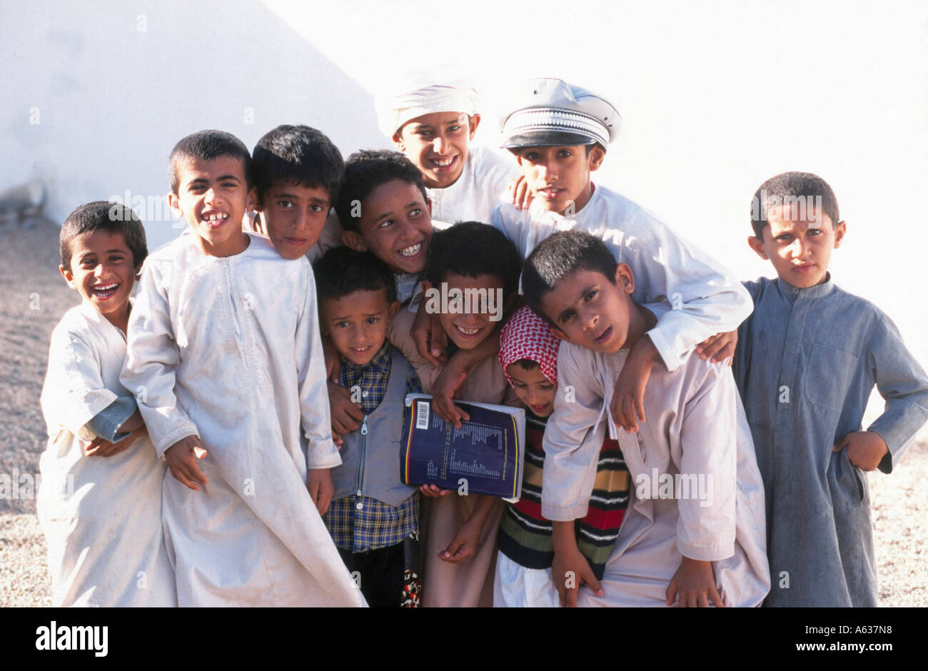 Portrait of group of children smiling, Oman Stock Photo - Alamy