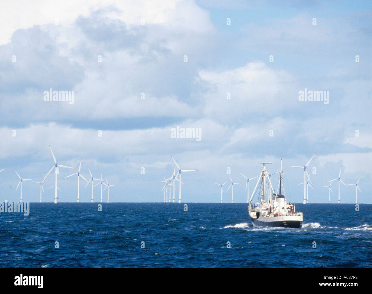 Wind turbines and ship in sea Stock Photo - Alamy