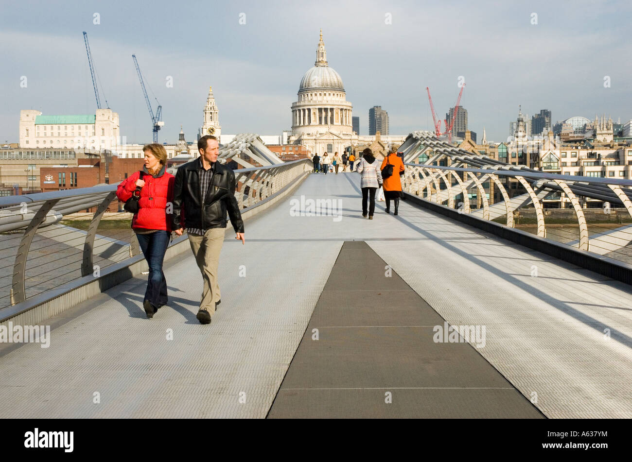 People crossing the Millenium Bridge London Stock Photo - Alamy